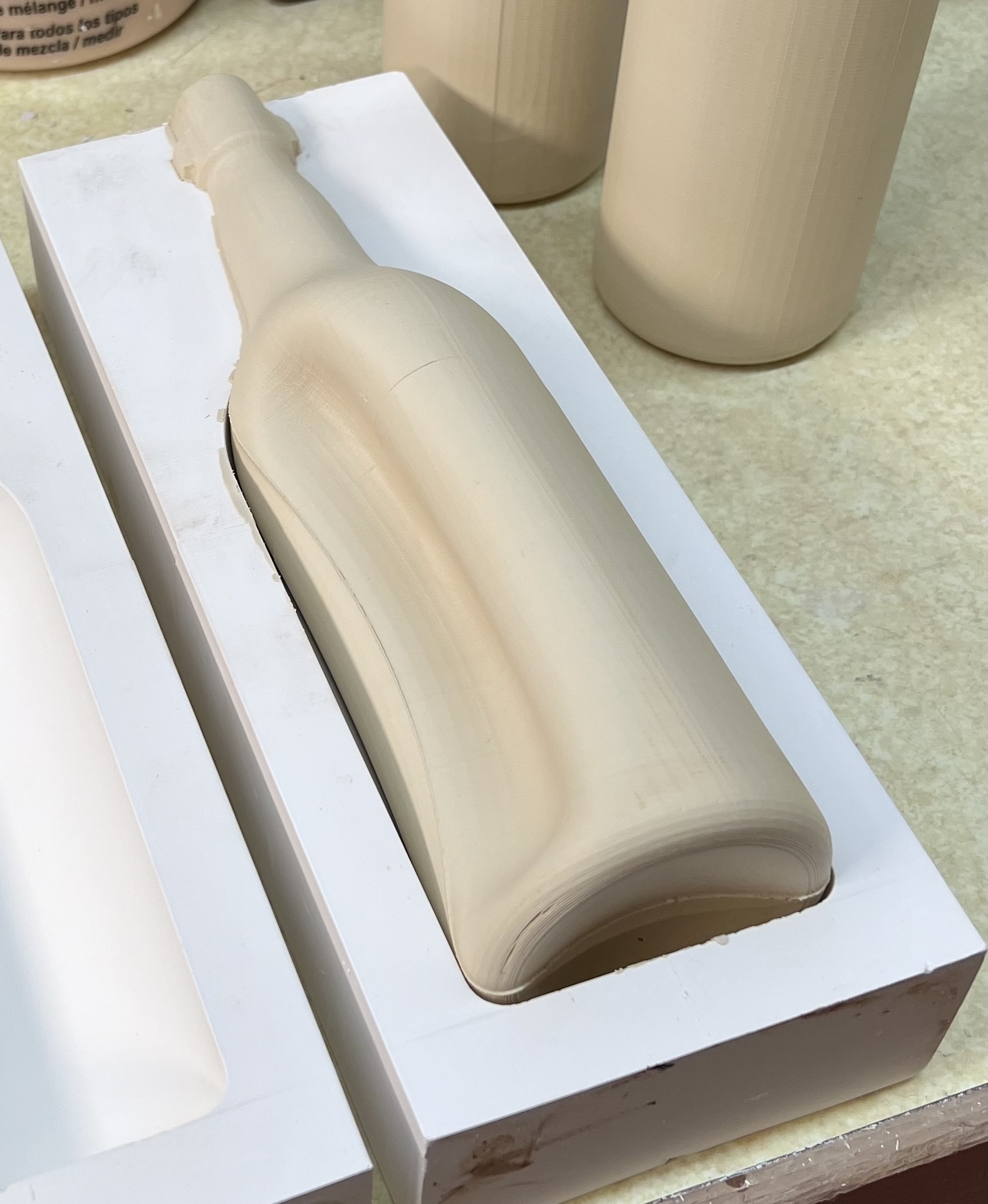 Draining has started turning this narrow necked bottle inside out